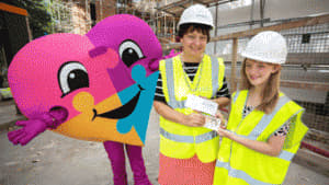 Young fundraiser Chloe visits Woking & Sam Beare Hospice site ...