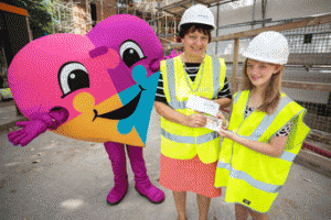 Young fundraiser Chloe visits Woking & Sam Beare Hospice site ...