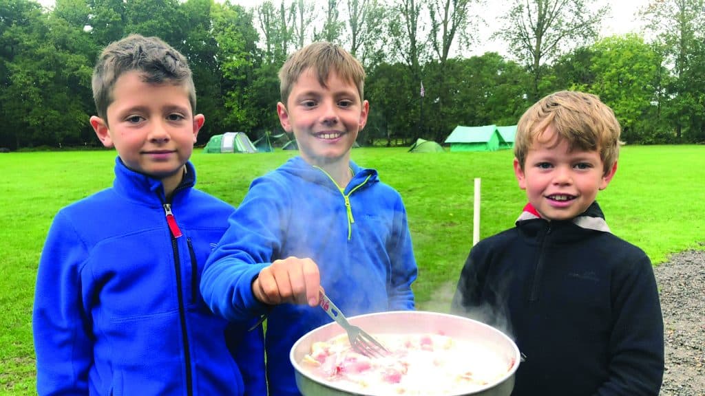 Cubs work through challenges to win highest award | wokingnewsandmail.co.uk