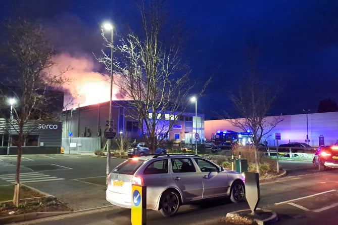 Firefighters tackling huge blaze at military battery factory in Ash ...