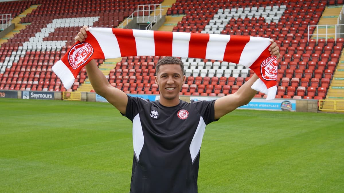 Cards sign left-sided defender | wokingnewsandmail.co.uk
